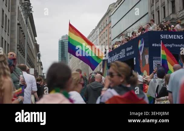 Berlin, Germany - June 2026: Rainbow flags wave above crowds and ...