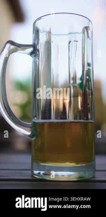 Almost finished beer glass during outdoor dining experience ...