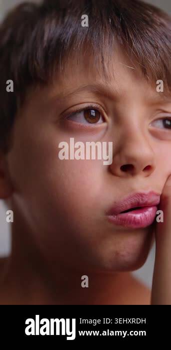 Child exhales dramatically during quiet family moment while appearing ...
