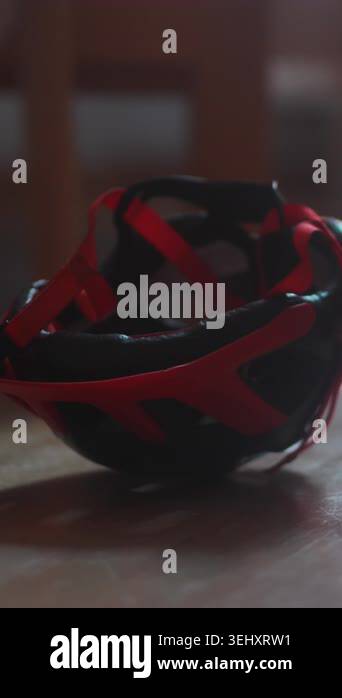 Protective kids helmet lying on home floor in calm interior setting ...