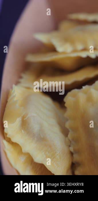 Handcrafted filled pasta organized inside reusable container showcasing ...