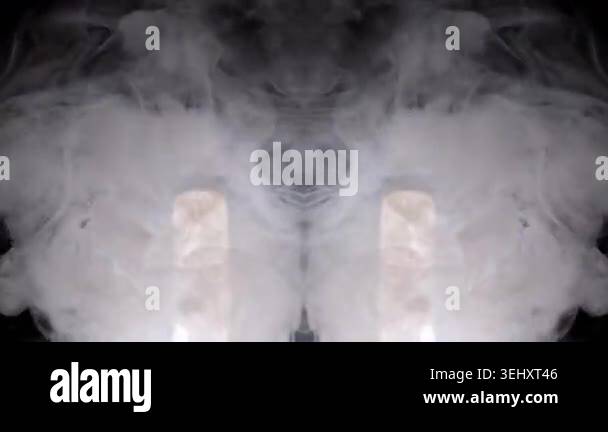 White smoke billows in a perfectly symmetrical mirrored pattern against ...