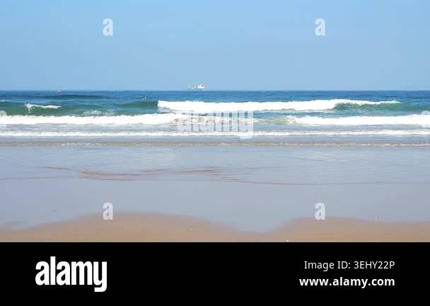 Wide sandy beach on the Atlantic Ocean coast in Agadir, Morocco. Gentle ...