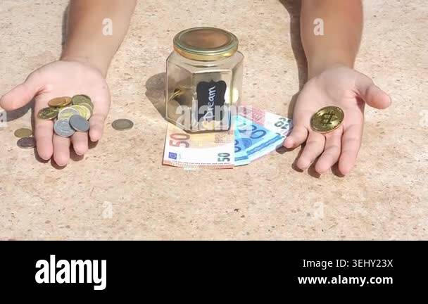 Close-up conceptual video of a child learning financial literacy and ...