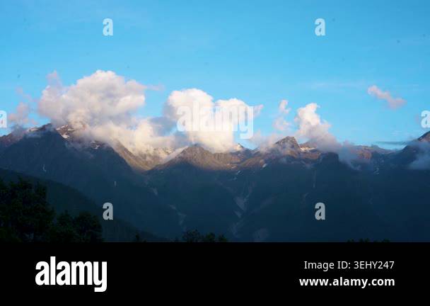 Panoramic view of towering snow-covered mountains in the Garhwal ...