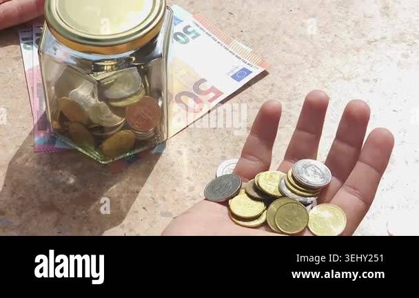 Close-up conceptual video of a child learning financial literacy and ...