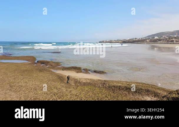Scenic rocky beach on the Atlantic coast in Agadir, Morocco. Gentle ...