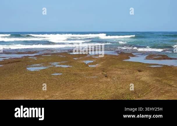 Scenic rocky beach on the Atlantic coast in Agadir, Morocco. Gentle ...