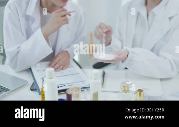 Scientists mixing ingredients in laboratory setting Stock Video Footage ...