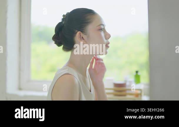 Woman touching her chin looking thoughtfully outside Stock Video ...