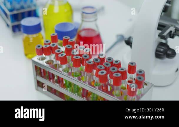 Colorful laboratory test tubes arranged in rack Stock Video Footage - Alamy