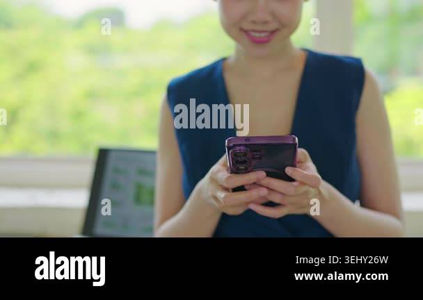 Businesswoman smiling while using smartphone indoors Stock Video ...