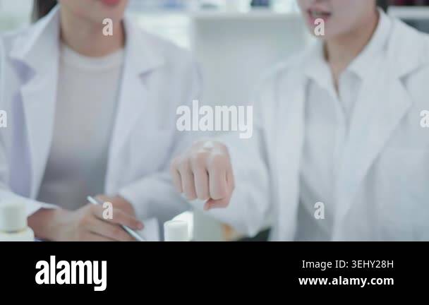 Two scientists discussing research in laboratory setting Stock Video ...