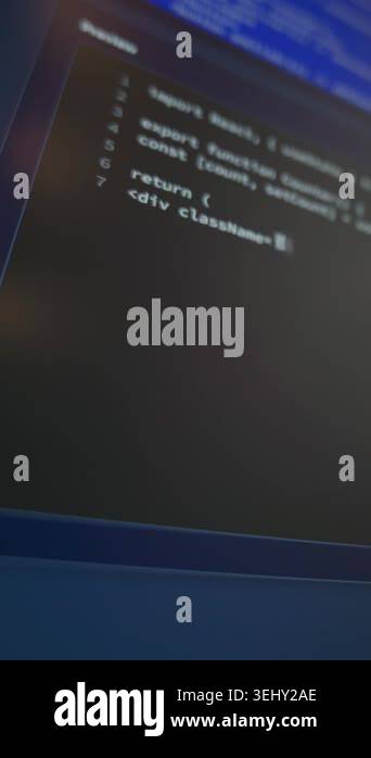 Macro shot of Javascript React code being typed out on a dark mode ...