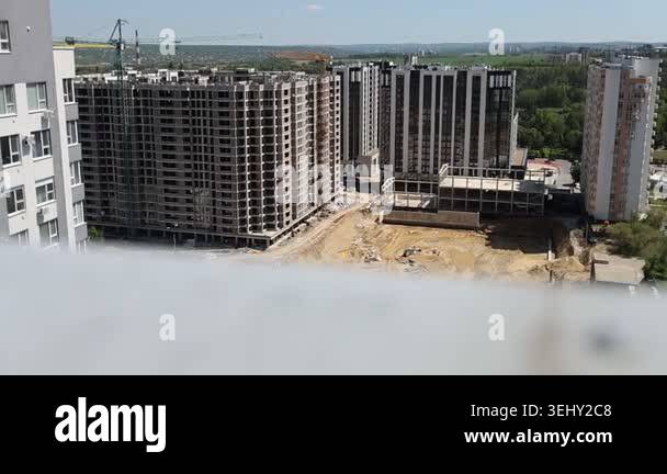 Balcony overlook construction site progress with blurred foreground ...