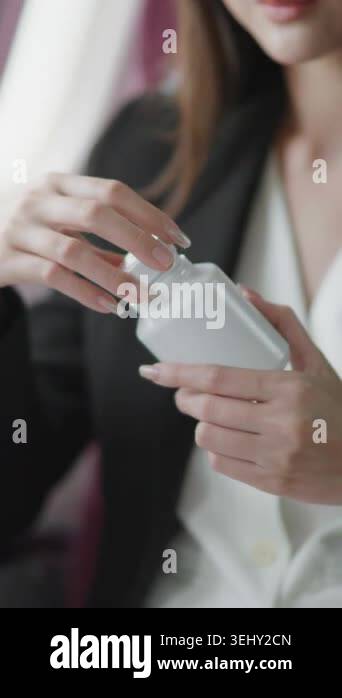 Businesswoman holding small white bottle in hand Stock Video Footage ...
