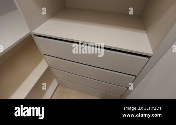 Hand Opening Drawer In Closet Revealing Fabric Sample Book And Tidy ...