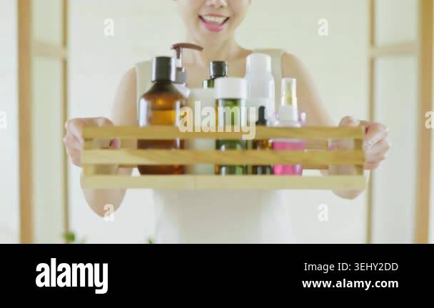 Woman holding wooden tray with skincare products Stock Video Footage ...