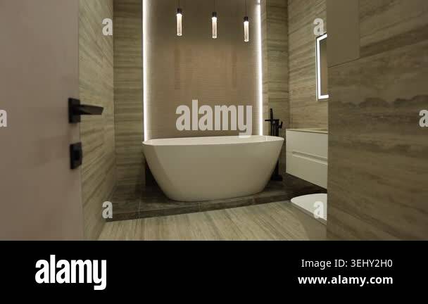 Spalike freestanding tub nestled in warm woodtoned bathroom, ambient ...