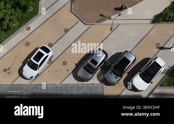 Aerial View Pedestrian Walking Past Cars, Concrete Plaza, Midmorning ...