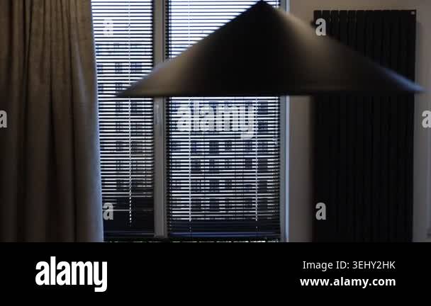 Moody Pendant Lamp Over Window Blinds Casting Soft Shadows, Curtain And ...