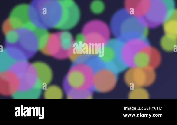 A dark background filled with blurred, colorful circles of light ...