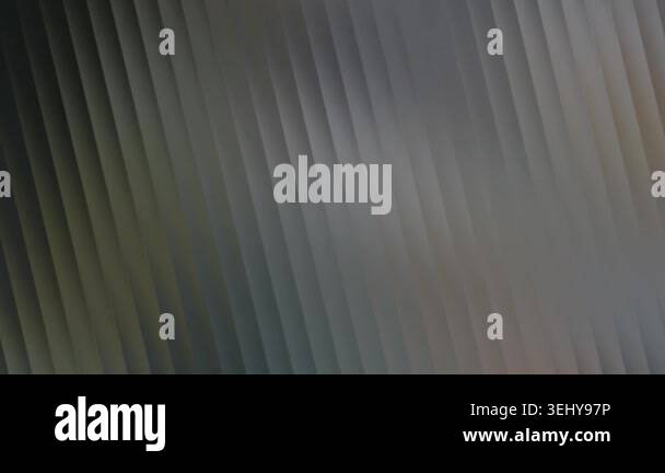 Vertical blinds with subtle light and shadow creating a textured ...
