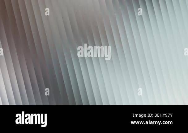 Abstract vertical blinds create a mesmerizing play of light and shadow ...