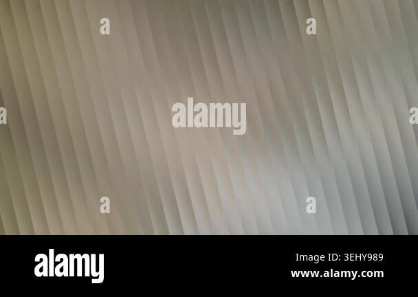 Abstract beige background featuring vertical lines, creating a textured ...