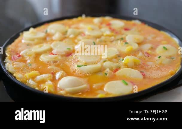 Close Up of Spanish Omelette, Frittata or Tortilla Cooking in Frying ...