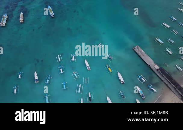 Drone View of Traditional Outrigger Boats and Jetty in Clear Turquoise ...