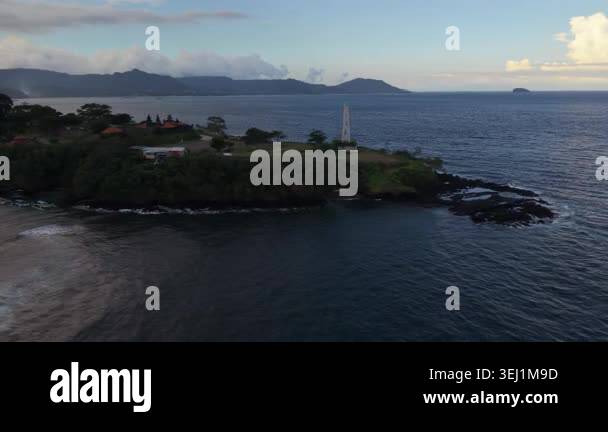 Aerial View of Padangbai Coastline with Lighthouse and Mountains at ...