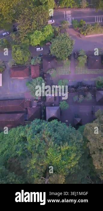 Aerial view of Pura Goa Lawah temple complex on the coast of Bali ...