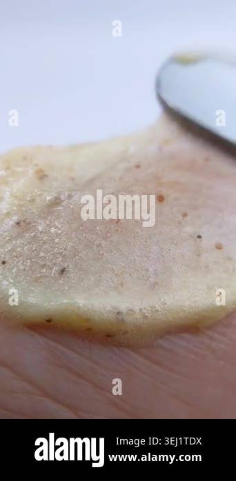 Close up process of spreading natural moisturizing cream on skin using ...