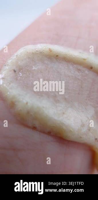 Applying skin cream using an applicator. Details of the cream texture ...