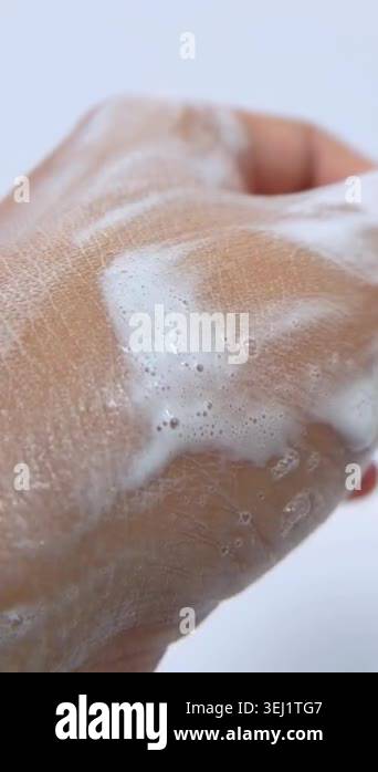 Showing palm of hand that has been soaped. Vertical close up view ...