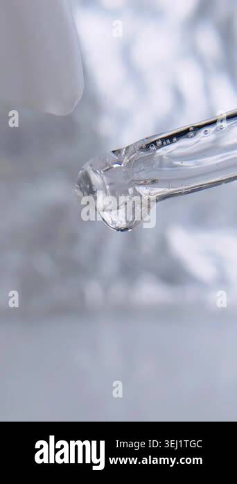 Clear liquid dripping from transparent pipette tip serum freshness ...