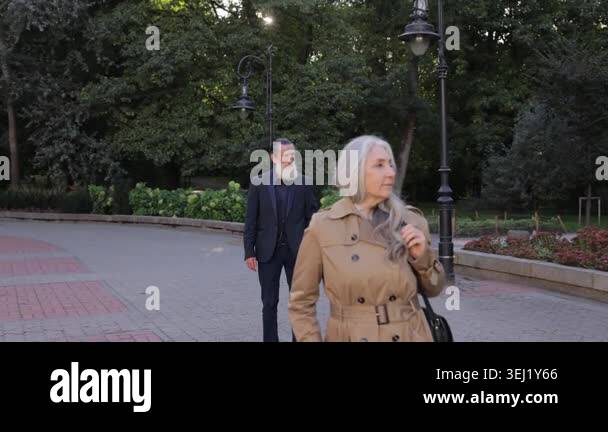 Mature man and woman with gray hair experiencing relationship problems ...