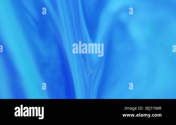 Vertical video. Stains art. Ink background. Defocused blue color water ...