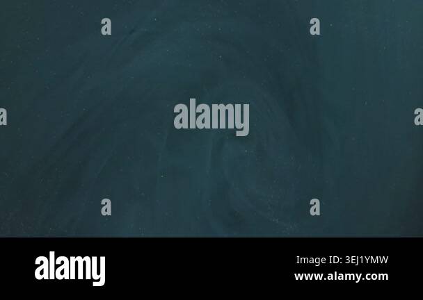 Flowing paint. Ink fluid. Defocused green color liquid chemical pigment ...