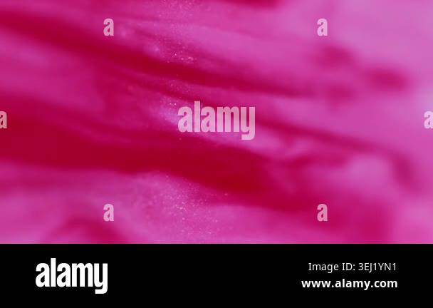Vertical video. Paint background. Color water. Defocused pink glitter ...