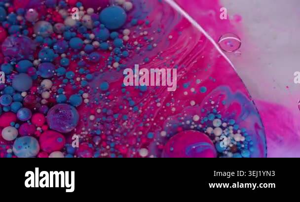 Oil drop. Paint liquid. Defocused pink blue purple colorful water round ...