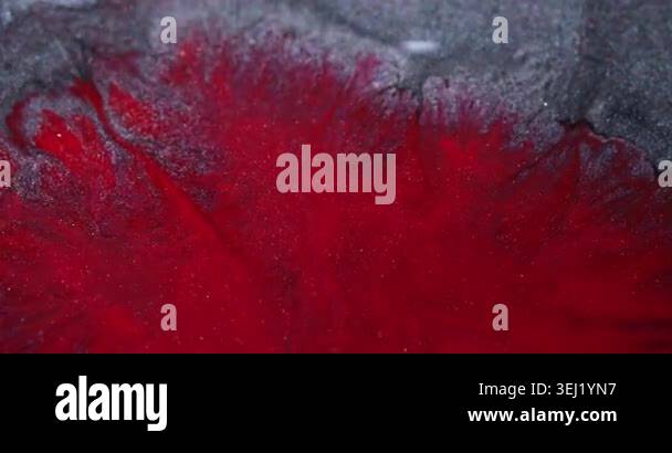 Red splash. Splatter fluid. Defocused silver vibrant color sparkling ...
