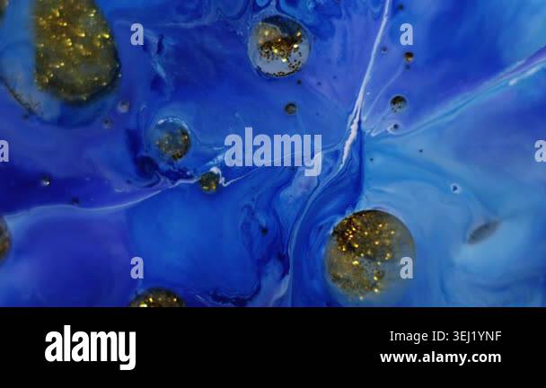 Drop emulsion. Shimmering fluid. Oil glitter spot floating on blue ...