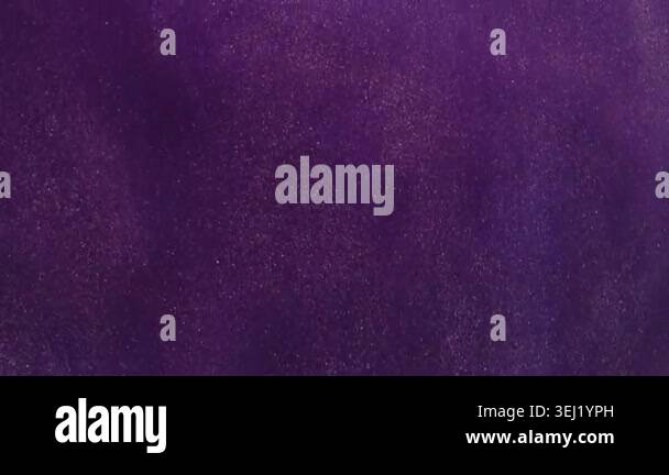 Floating ink. Wet texture. Defocused purple color grain paint in water ...
