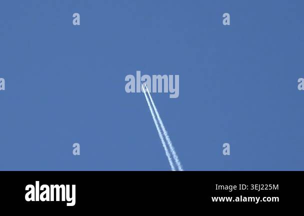 Low angle view of distant commercial jet aircraft cruising at high ...