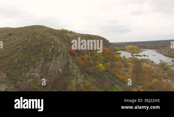 Aerial drone view of a rocky river canyon with granite cliffs and ...