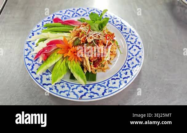 Thai banana blossom salad with chicken in porcelain plate Stock Video ...