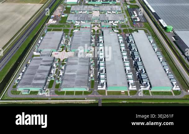 Aerial reveal shot of a large data center complex with modern ...