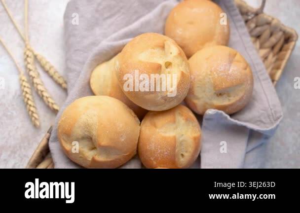 Freshly baked kaiser rolls in wicker basket Stock Video Footage - Alamy